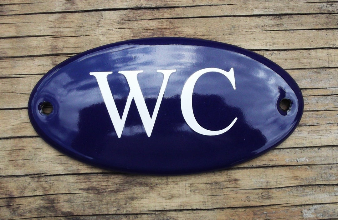 Classic Enamel WC Bathroom Sign. White Text on a Blue Background ...