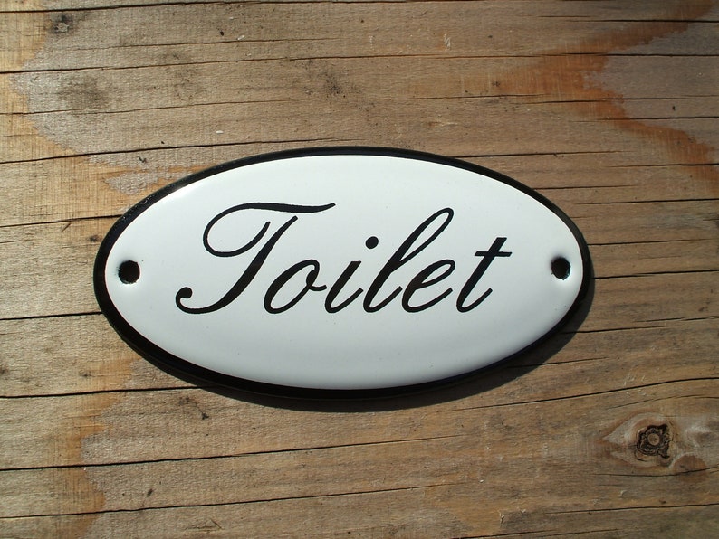 Classic Enamel Toilet Sign. Black Text on a White Background, Oval ...