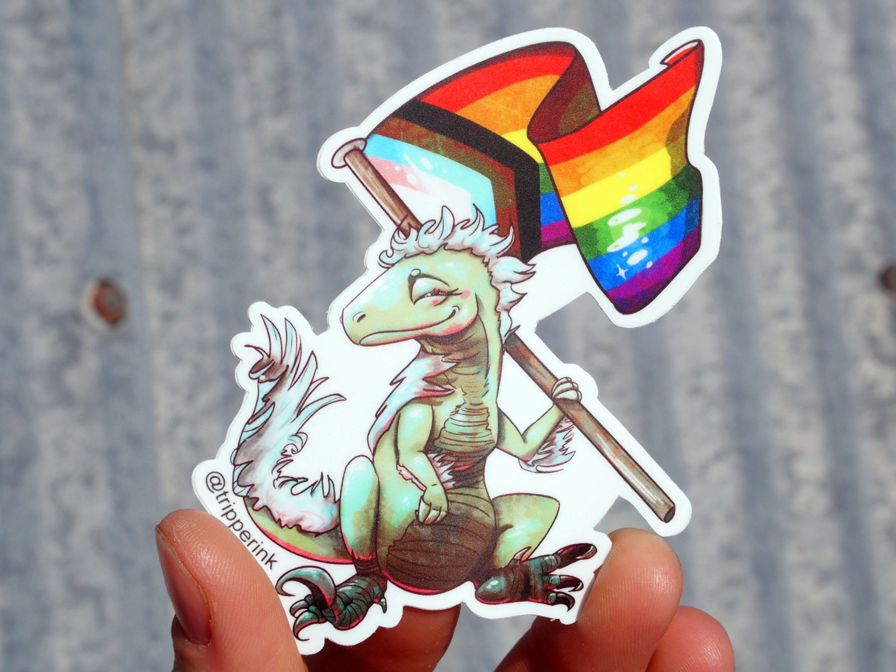 Dinosaur holding a gay pride flag sticker — Crooked Stickers