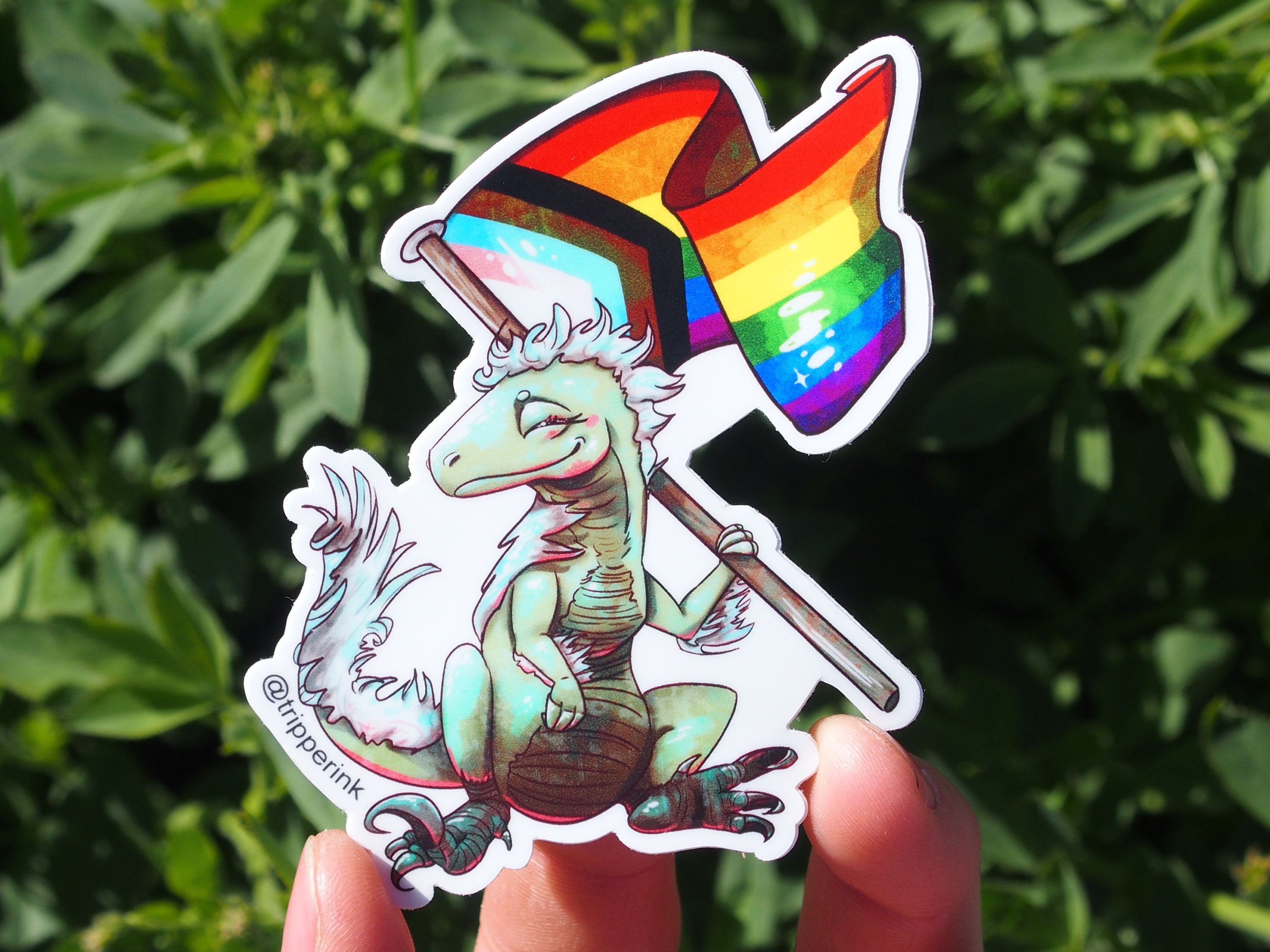 Dinosaur holding a gay pride flag sticker — Crooked Stickers