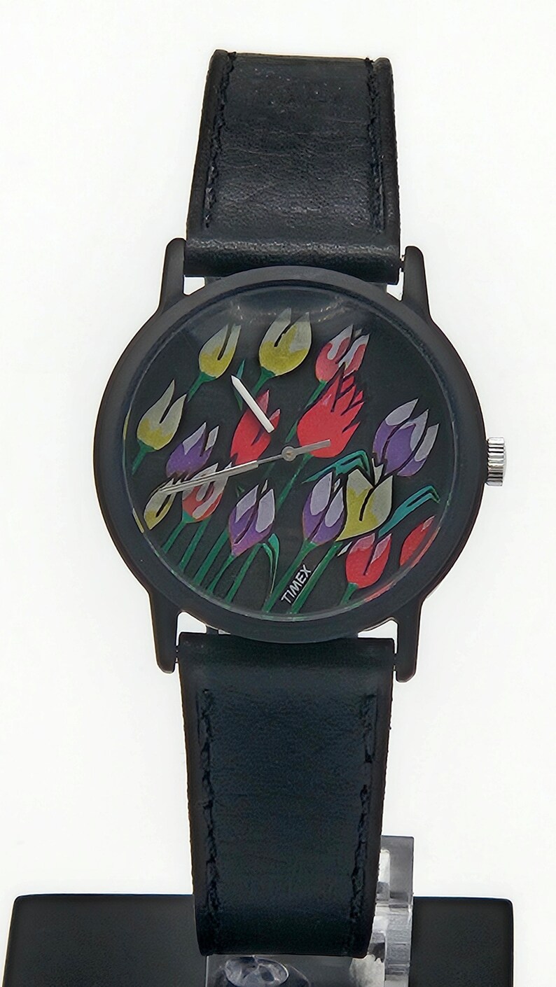 Vintage Unique Timex Watch Features a Black Face Decorated With Multi ...