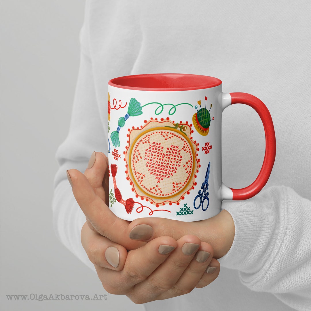 A Mug With Illustrations of Embroidery Tools, Cross Stitched, Threads ...