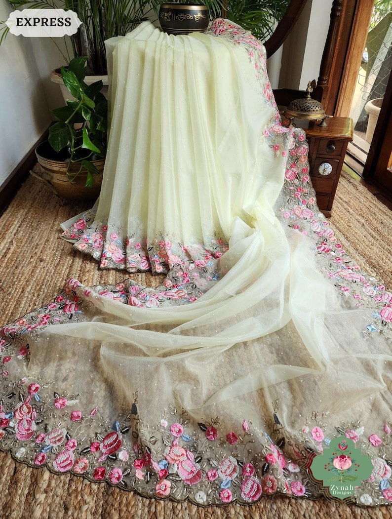 Zynah Pastel Lemon Yellow Organza Silk Saree With Floral Emb & Hand ...