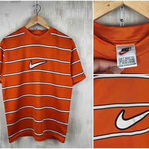 Nike 1981-1983 Medium Blue Swoosh Made in USA T Shirt Nike 1981-1983 Medium Blue Swoosh Made in USA T Shirt