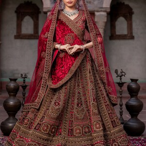 Lehenga: Exquisite Ruby Imperial Lehenga With Hand-embroidery in Velvet ...