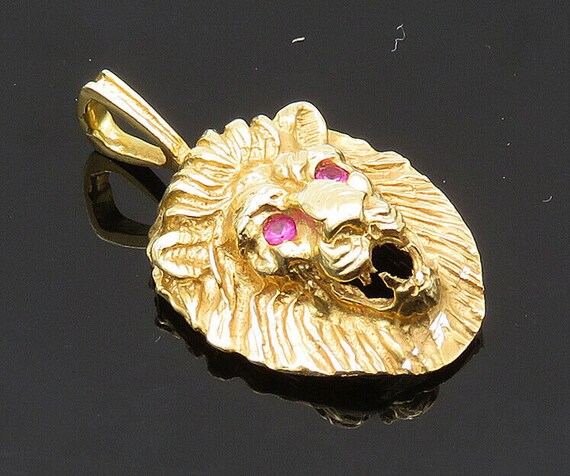 Gold lion pendant with ruby eyes store