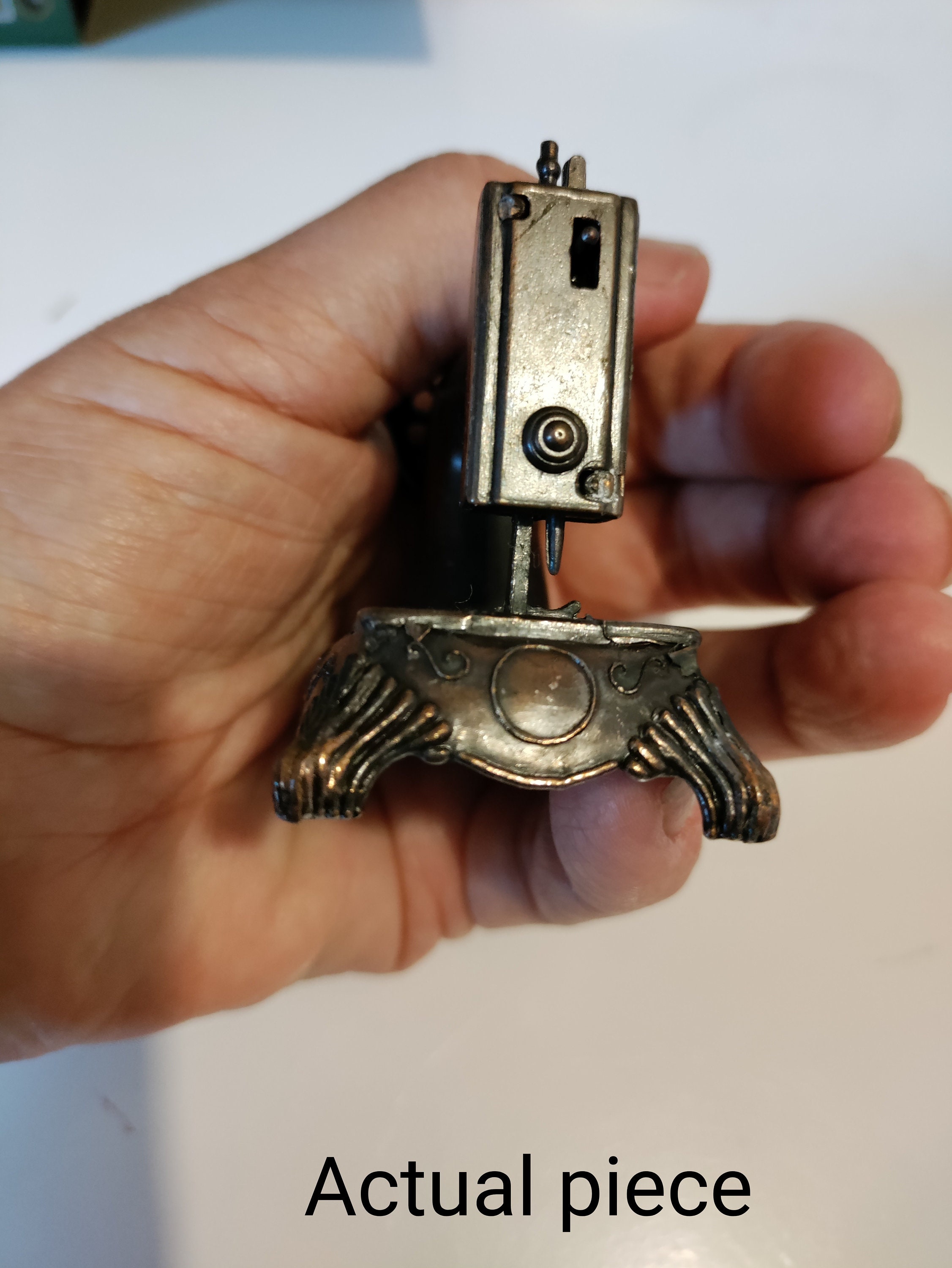 A Coppery Miniature Metal Sewing Machine Was Made in Hong Kong as an ...