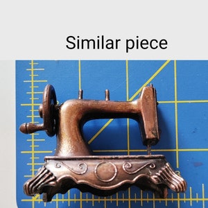 A Coppery Miniature Metal Sewing Machine Was Made in Hong Kong as an ...