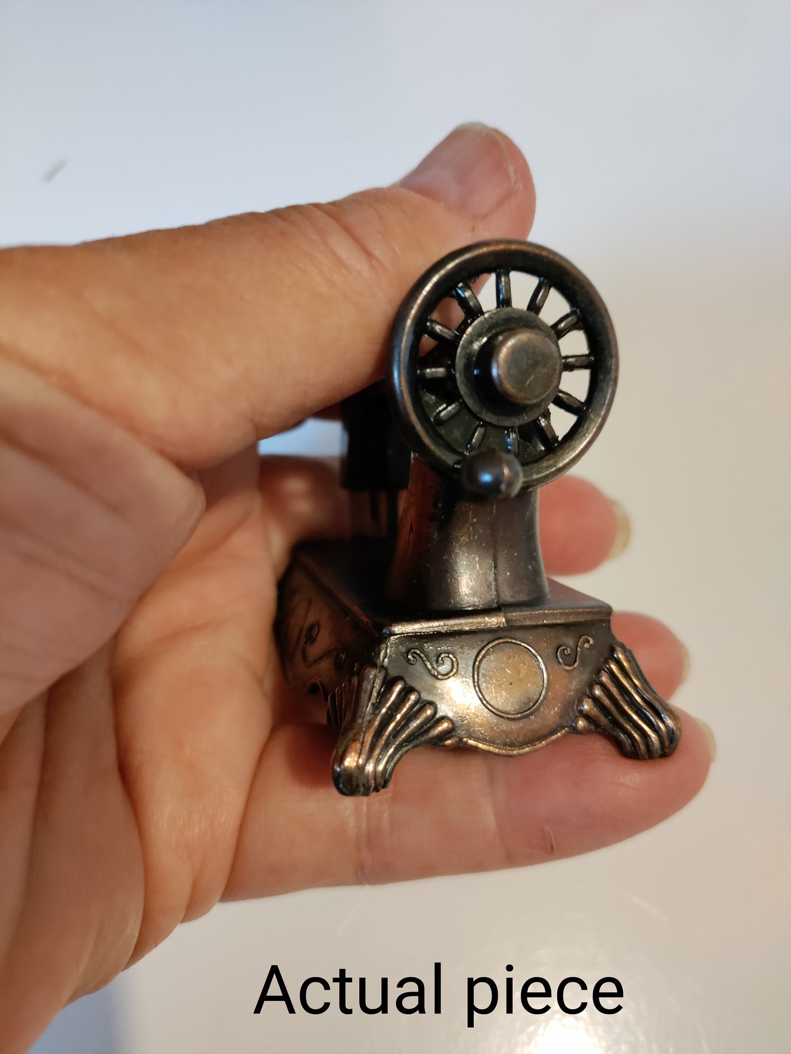 A Coppery Miniature Metal Sewing Machine Was Made in Hong Kong as an ...