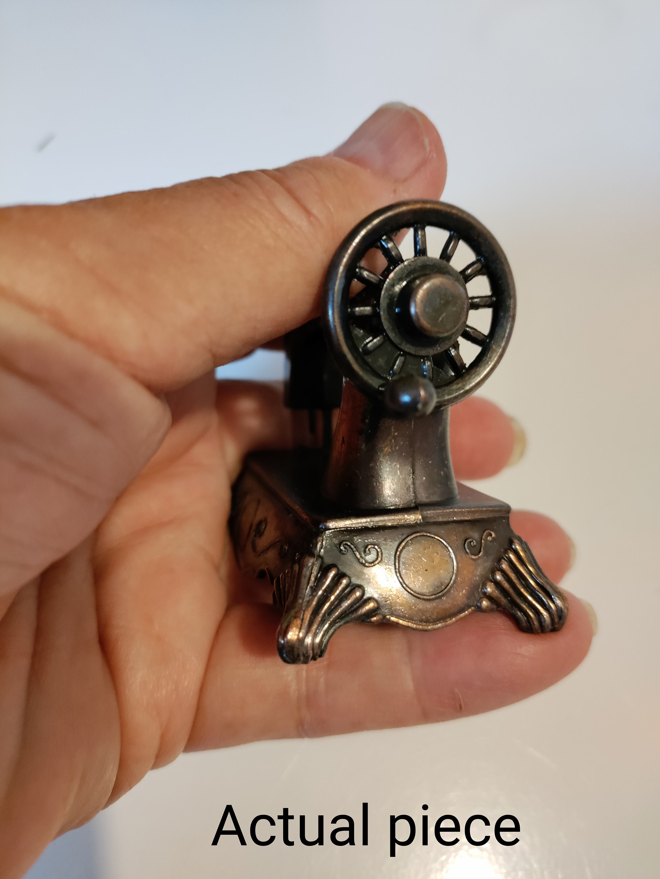 A Coppery Miniature Metal Sewing Machine Was Made in Hong Kong as an ...