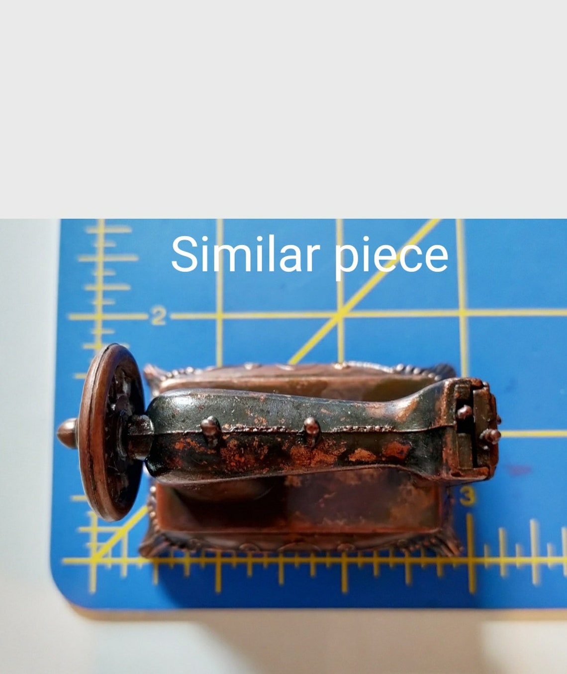 A Coppery Miniature Metal Sewing Machine Was Made in Hong Kong as an ...