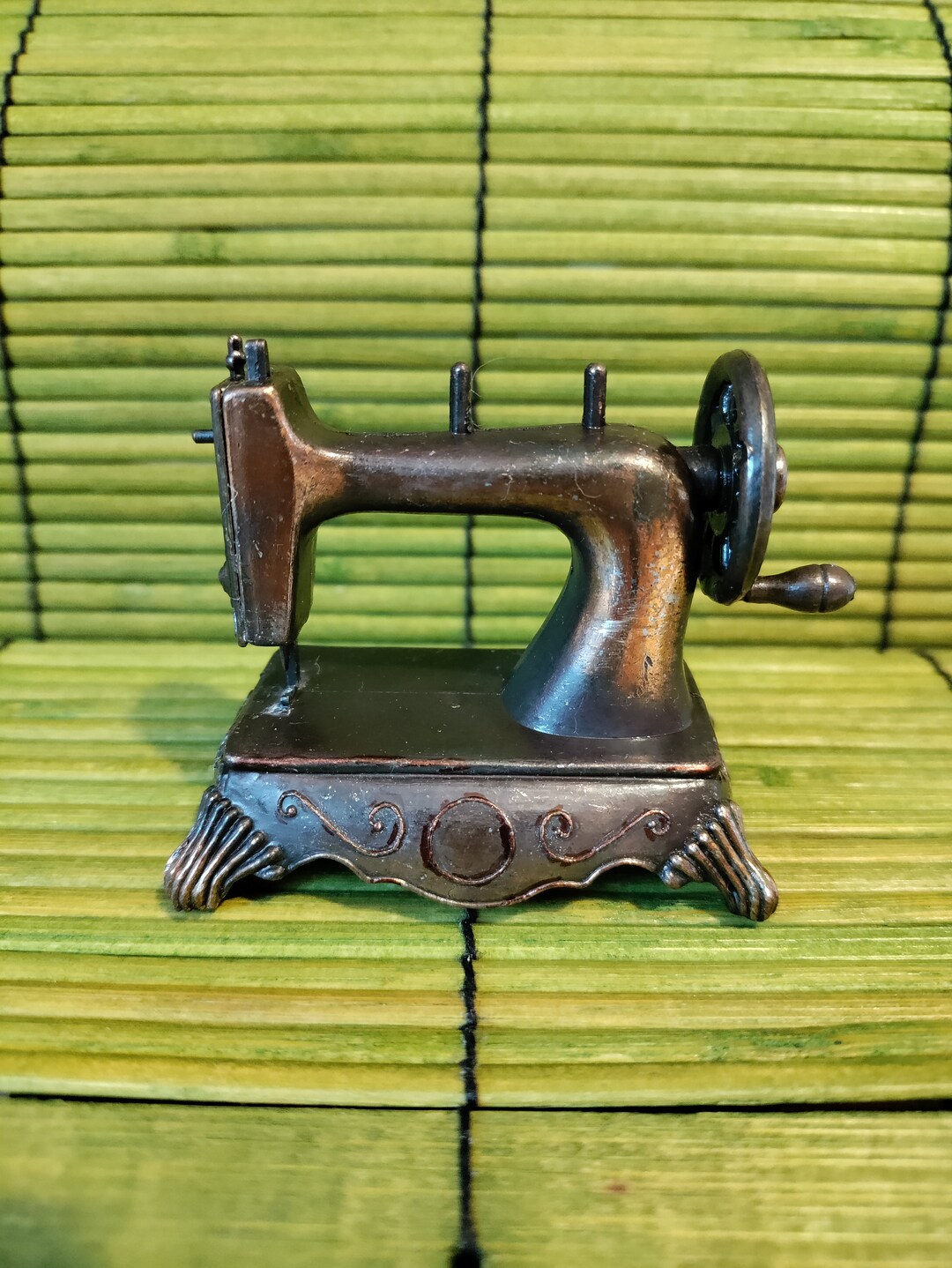 A Coppery Miniature Metal Sewing Machine Was Made in Hong Kong as an ...