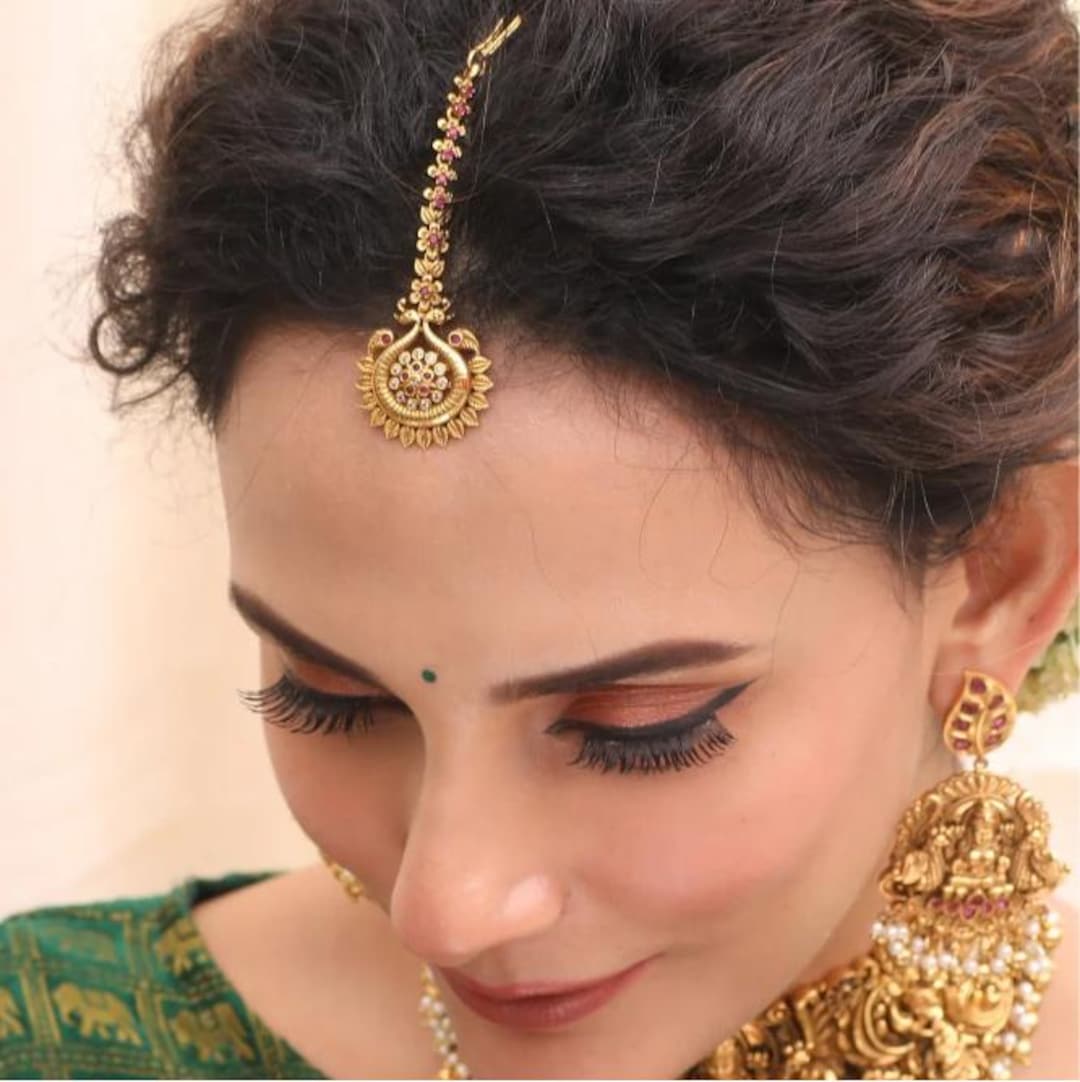 Tarinika Antique Gold Plated Leafy Maangtika With Peacock Design ...