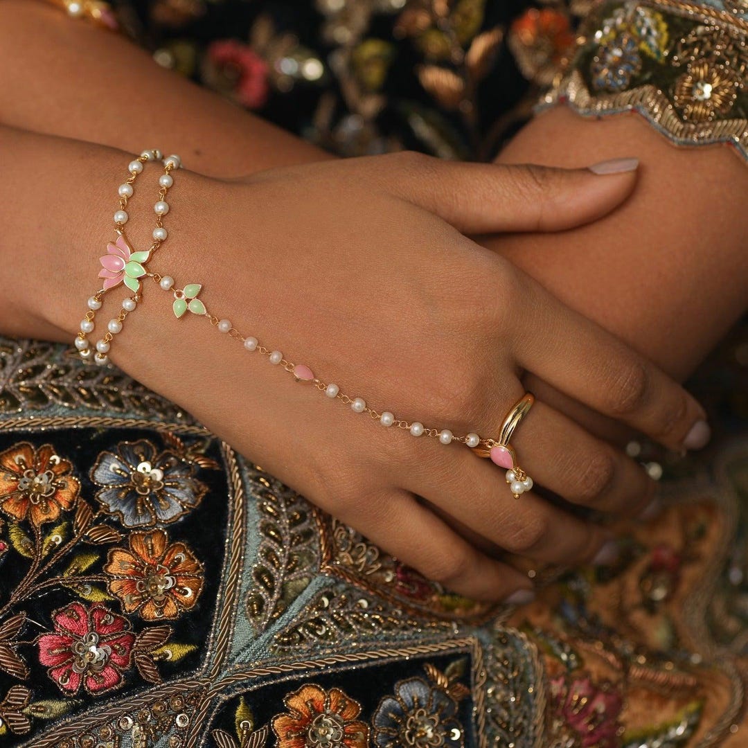 Tarinika Jalaja Double Pearl Ring Hand Chain Bracelet, Lotus Motif Gold ...