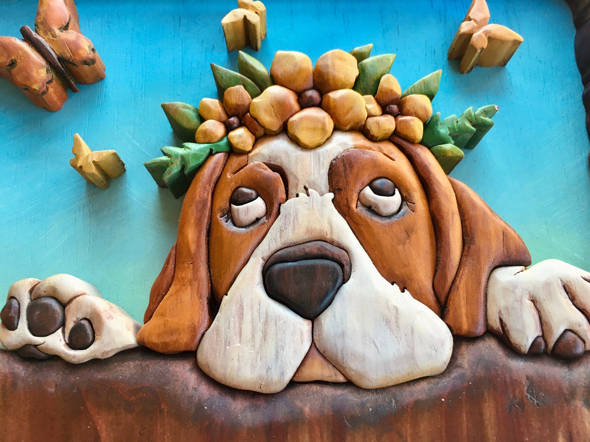 Carved Dog and Butterflies Wall Hanging on a Blue Gradient Background ...