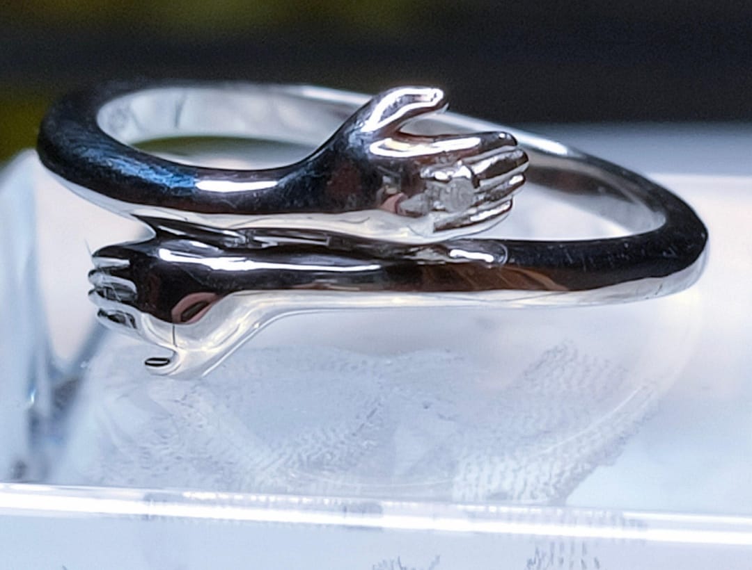 Diamond Hug Hands Ring: Platinum Overlay Sterling Silver Bypass Band ...