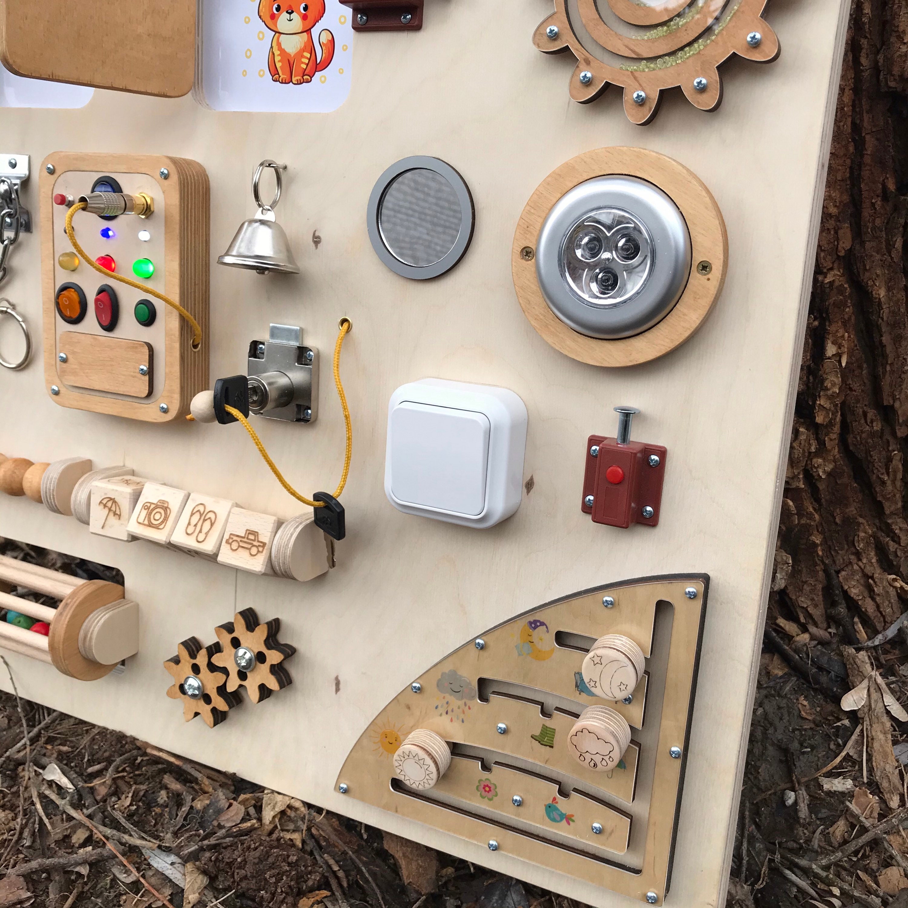 Natural busy board for toddlers with switch box and lights | Etsy