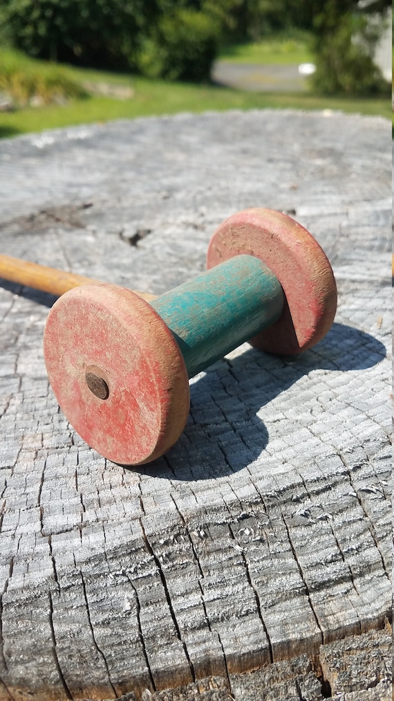 Wooden Wheel And Stick Toy