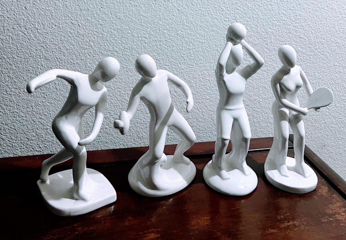 Set of 4 Dynamic Sport Player Figurings Their Depicting Different ...