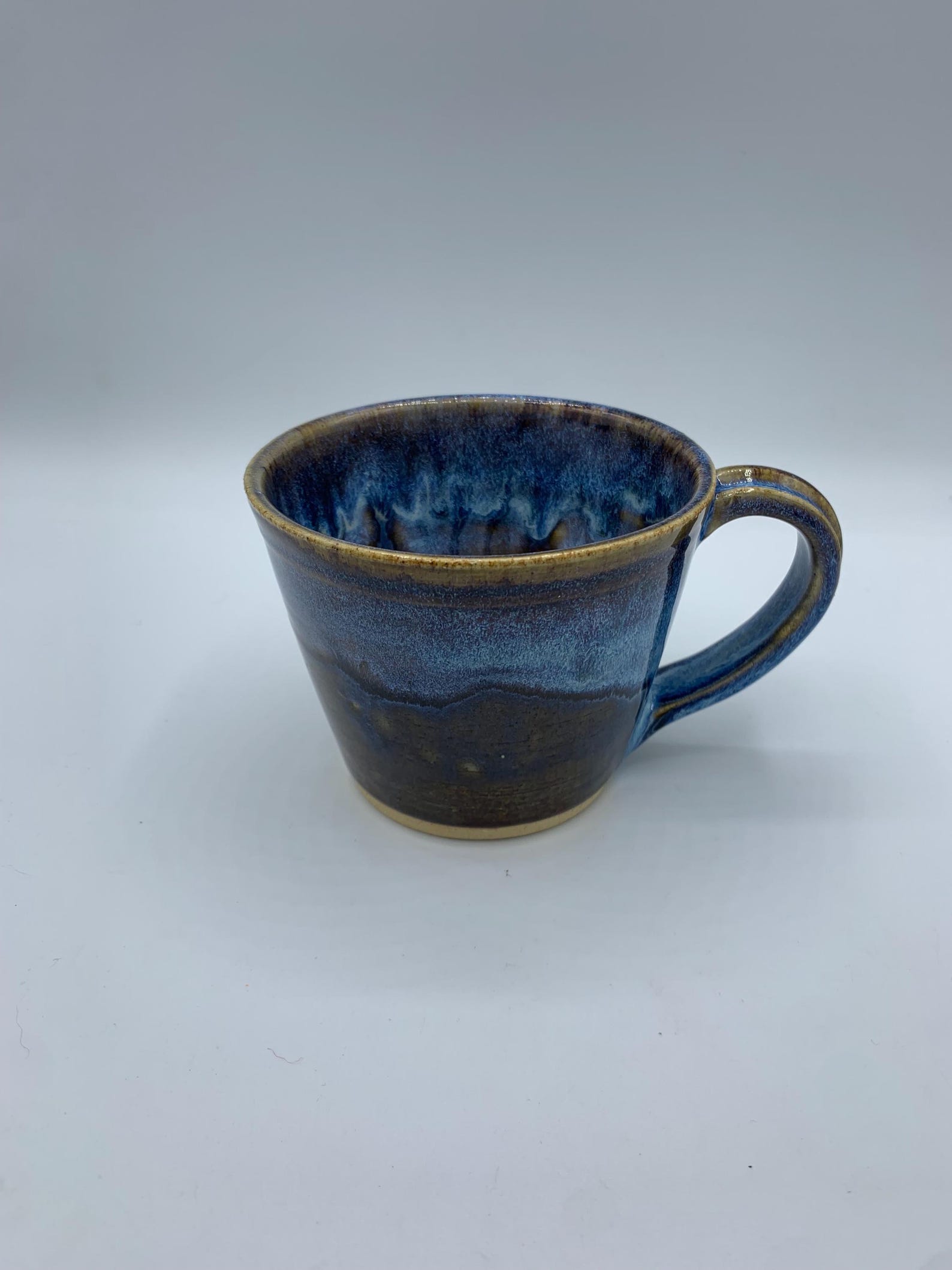 Handmade Ceramic Mug: Flowing Blue Hues on Brown - Etsy