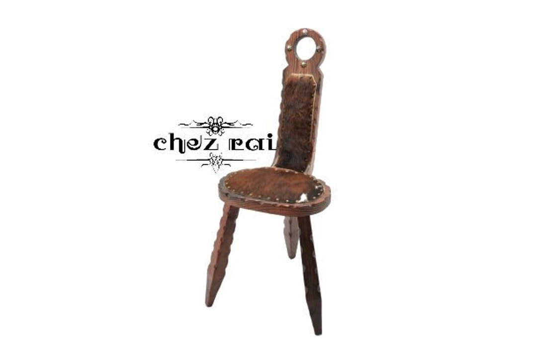Three legged chair antique store