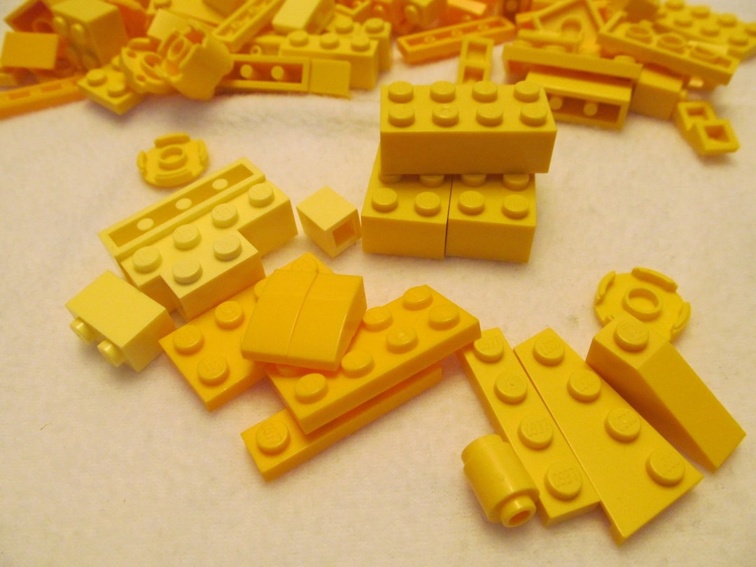 One Hundred Twenty Eight Lego Pieces, Four Shades of Yellow Lego Pieces ...