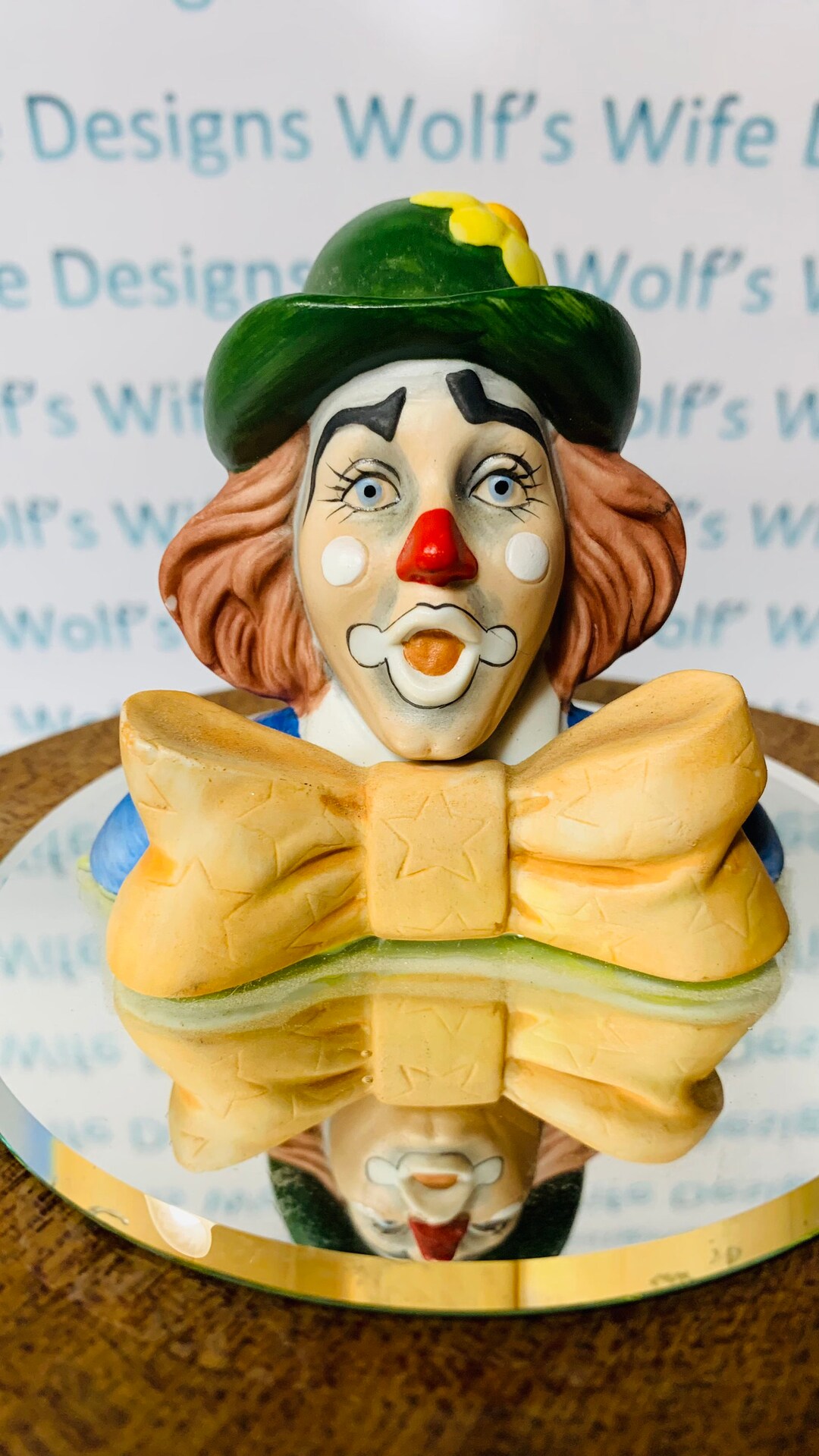 Beautiful Detailed Clown Head on Top of Circle Mirror on Top of Wooden ...