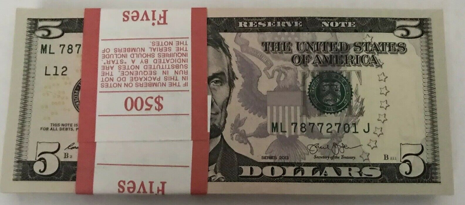 Stacks Of 5 Dollar Bills