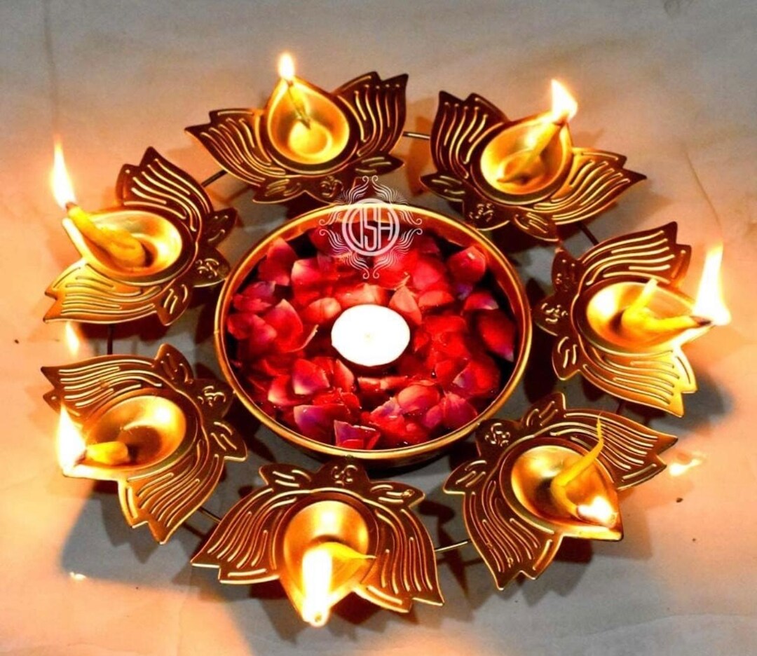 Golden Metal Handcrafted Designer Urli With 7 Diyas - Elegant Home ...