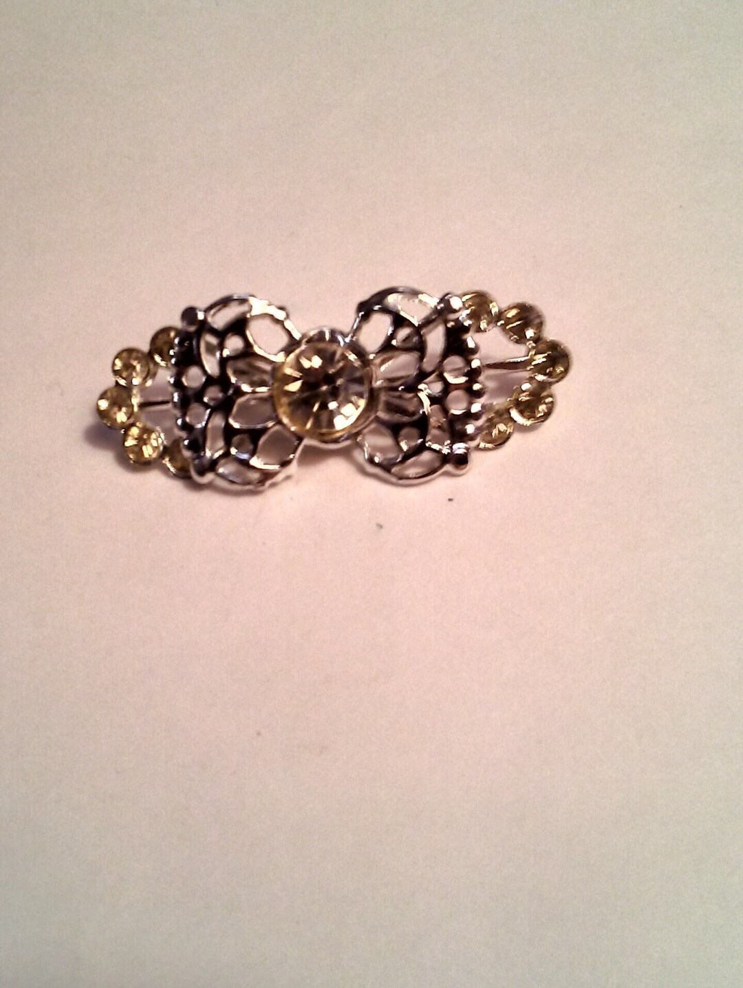 Vintage Rhinestone Silver Toned Metal Pierce Worked Bow Shaped Pin ...