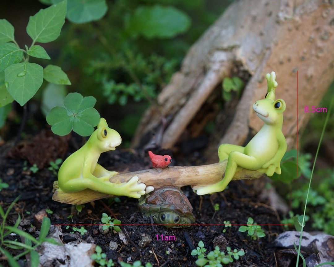 Miniature Two Frogs Playing at Seesaw With Bird Tortoise , Miniature ...