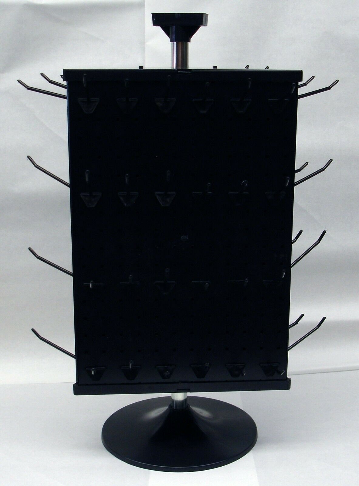 A 3 Sided Black Plastic Counter Top Peg Board Spinner Rack Display With ...