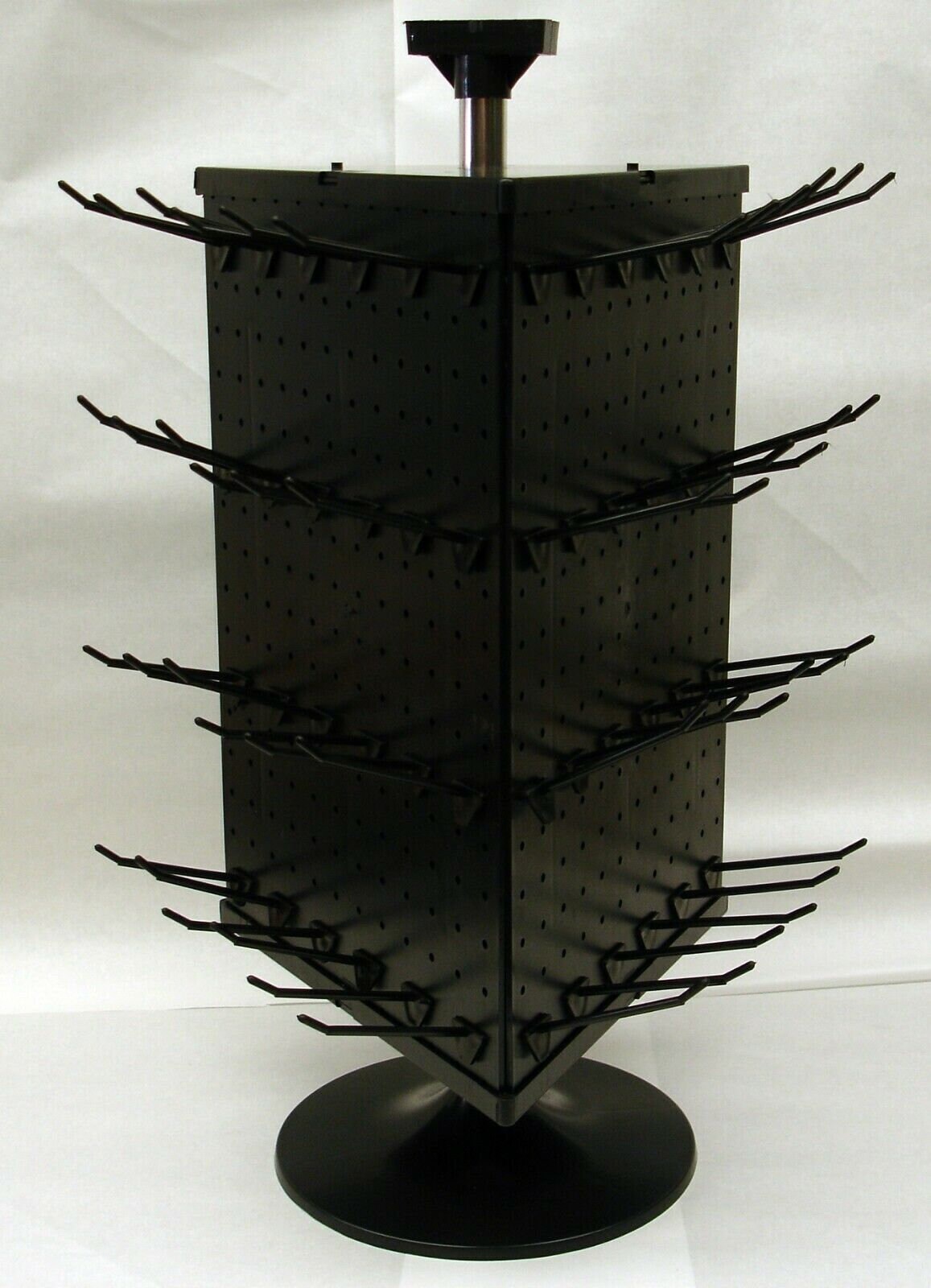 A 3 Sided Black Plastic Counter Top Peg Board Spinner Rack Display With ...