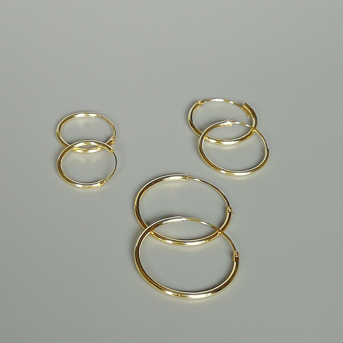 Endless hoop gold earrings set Three pairs set 121618 mm | Etsy