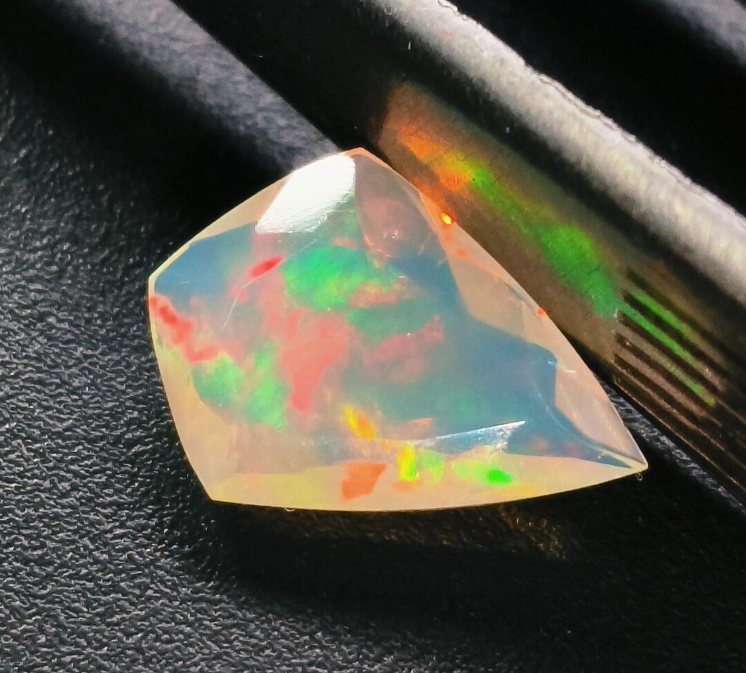 AAA++ Faceted Ethiopian Opal Shield Shape: 1.10 Carat Gemstone 10.5x7 ...