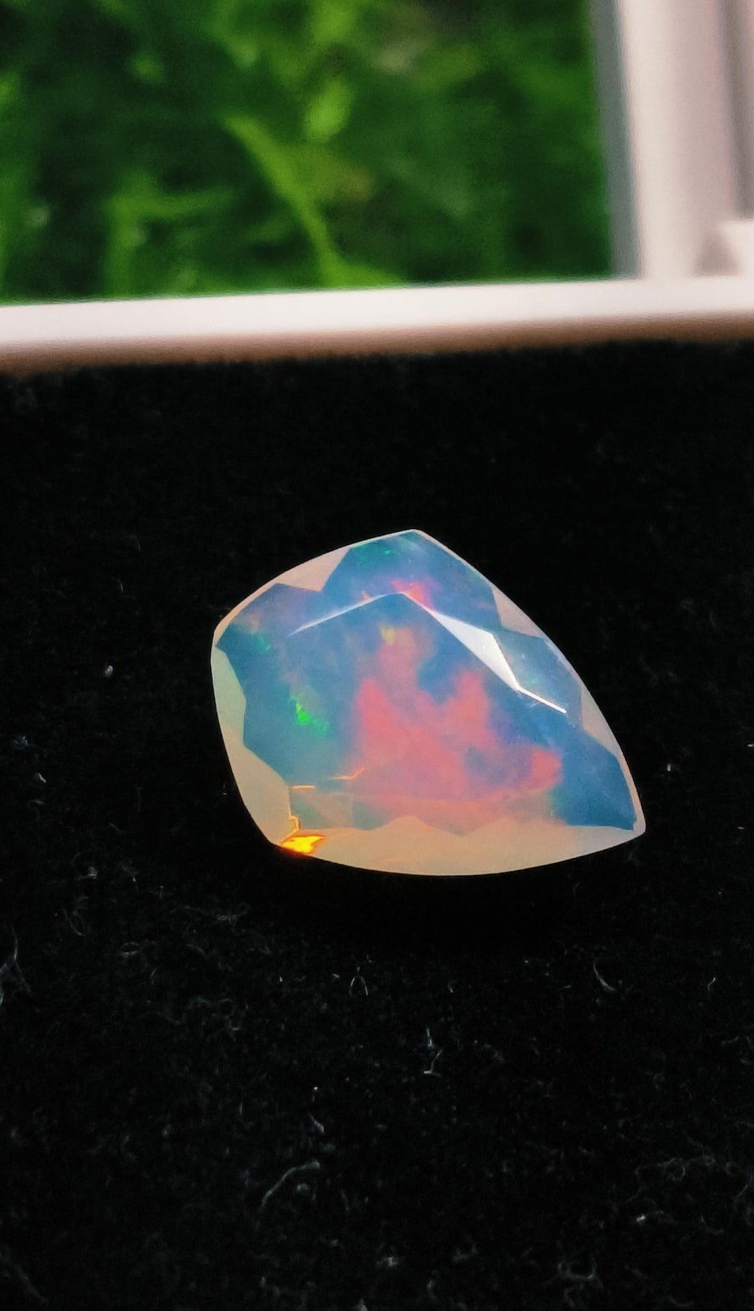 AAA++ Faceted Ethiopian Opal Shield Shape: 1.75 Carat Gemstone 12x9x4.4 ...