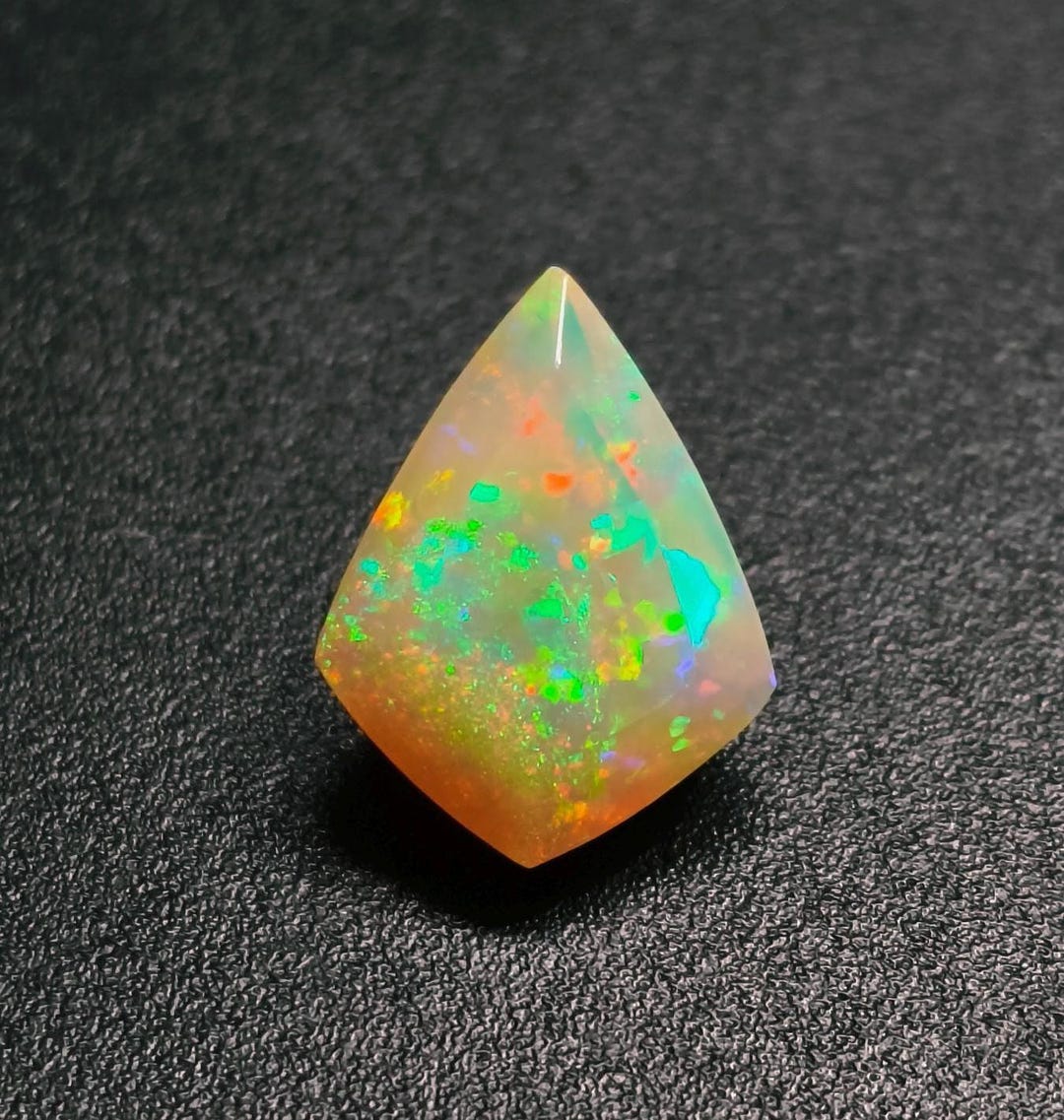 AAA++ Faceted Ethiopian Opal Shield Shape: 2.00 Carat Gemstone 11x8.5x5 ...