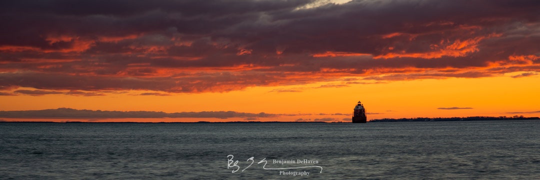 Sandy Point Shoal Lighthouse Silhouette From Sandy Point State Park in ...