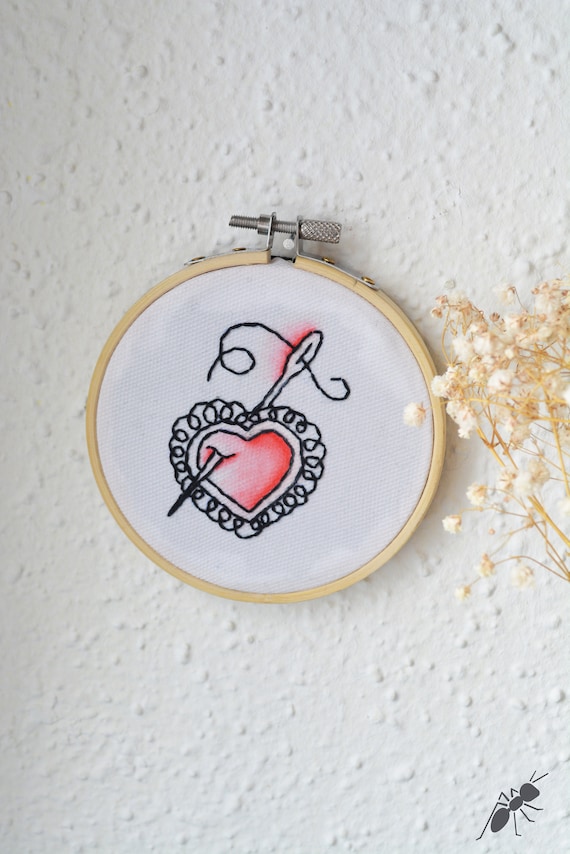 Stitched Heart With Needle Tattoo