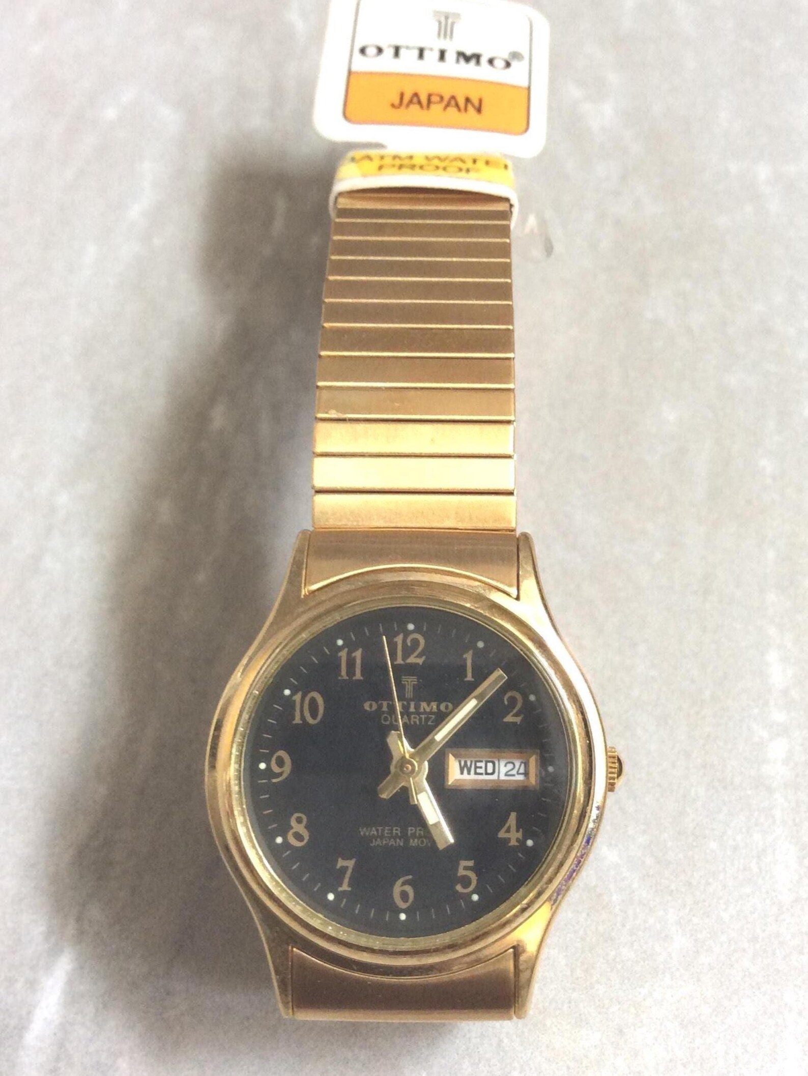 OTTIMO Gold Women's Watch Round Black Dial Gold Numbered Hours on Gold ...