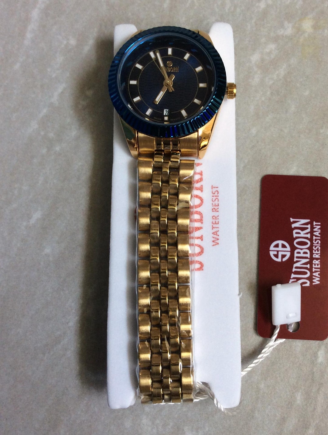 SUNBORN Women's Watch Round Blue Dial Index Hours, With Date, on a Gold ...