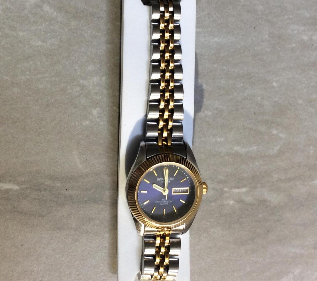 SWANSON Women's Watch Round Blue Dial Gold Index Hours Day & Date All ...
