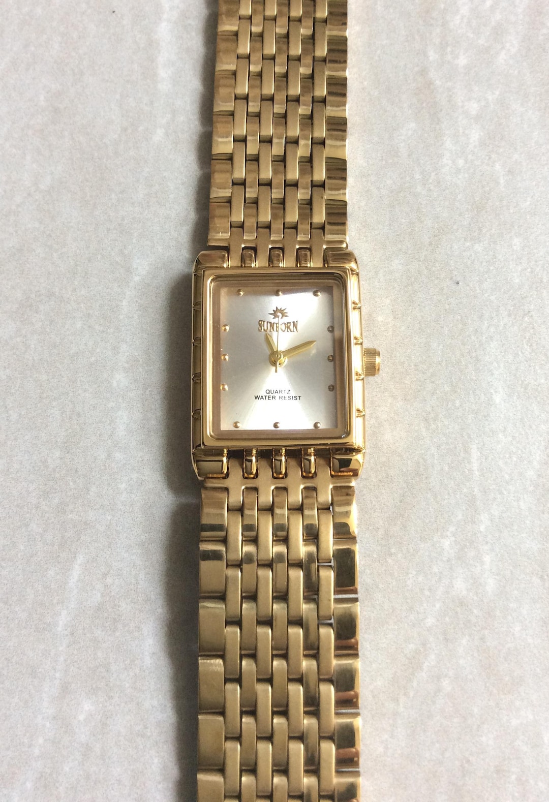 SUNBORN Gold Women's Watch Having a Rectangle Silver Dial Gold Indices ...