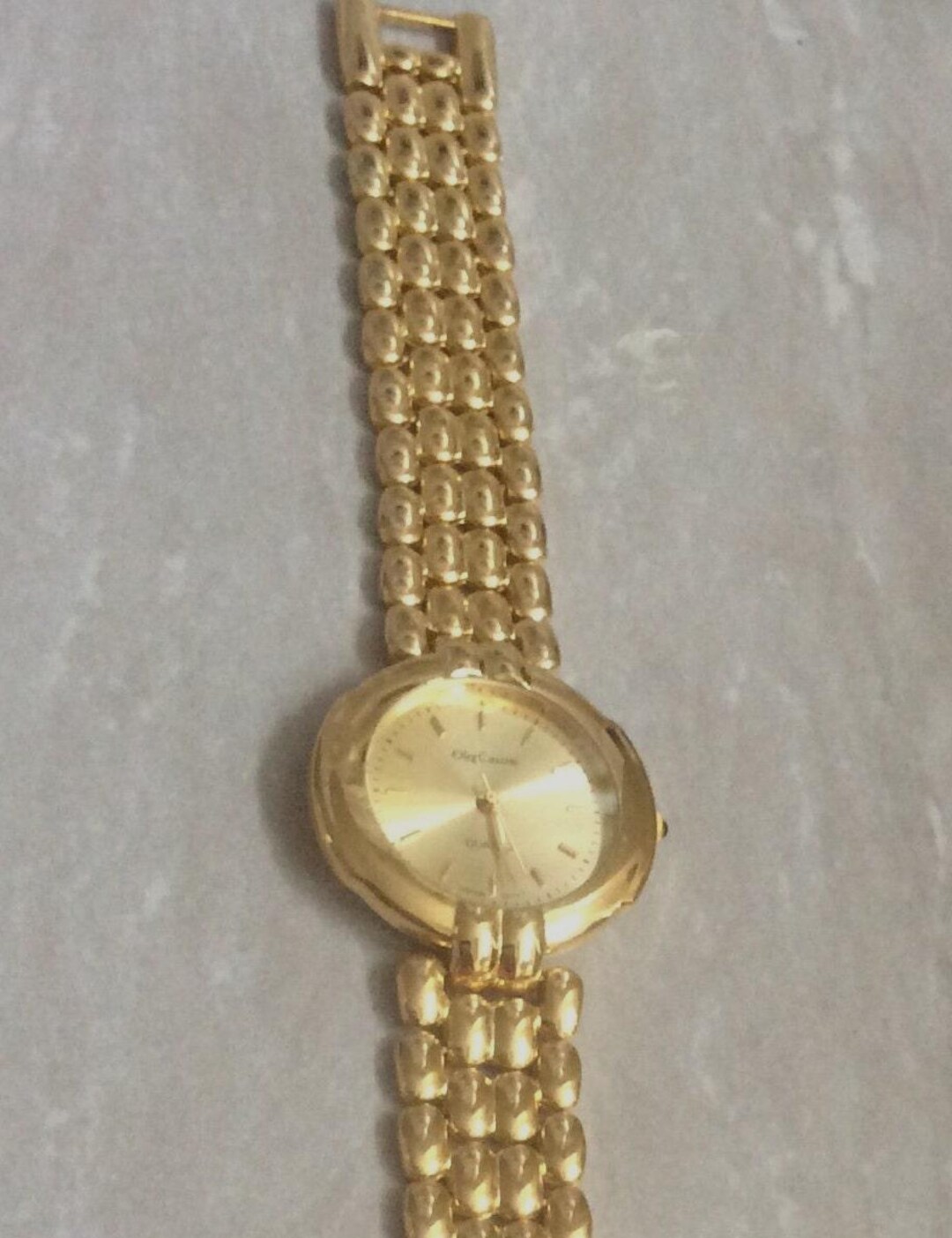 Oleg Cassini Men's Gold Watch Round Gold Dial Index Hours on Unique ...