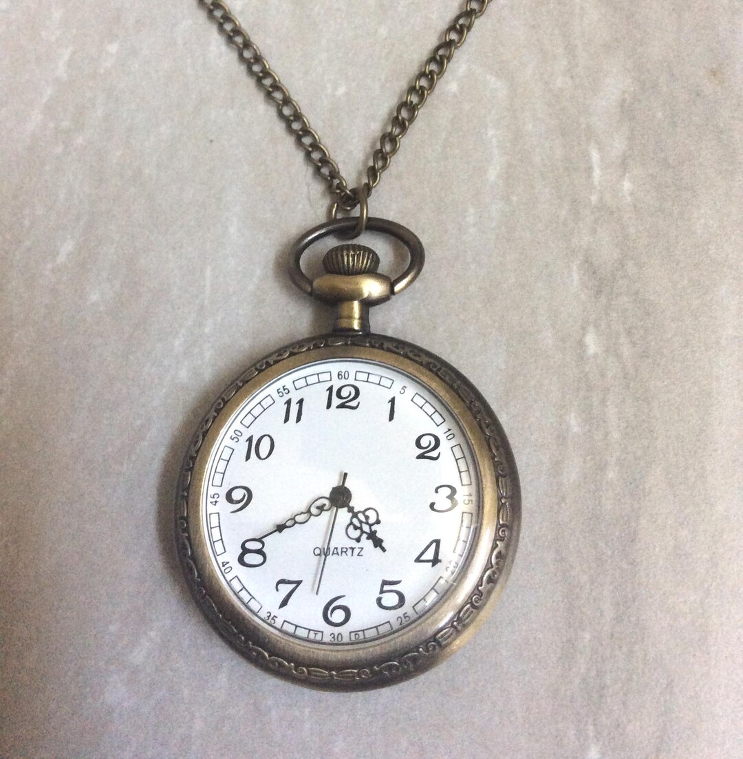 Pocket Watch Round White Dial Black Numbered Hours on an Antique Gold ...