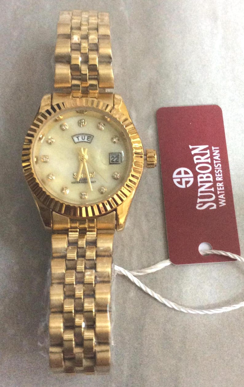 SUNBORN Women's Gold Watch Having a Round Golden Pearl Day and Date ...