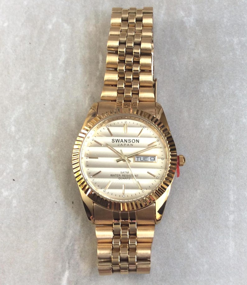 SWANSON Men's Gold Watch Round Gold Accented Dial Displaying Gold Index ...