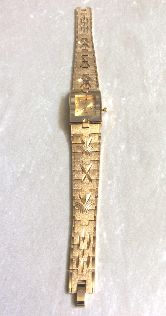 SUNBORN Women Gold Mirror Image Rectangle Watch havin… - Gem