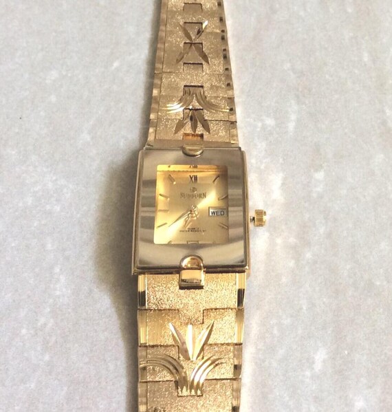 SUNBORN Women Gold Mirror Image Rectangle Watch havin… - Gem