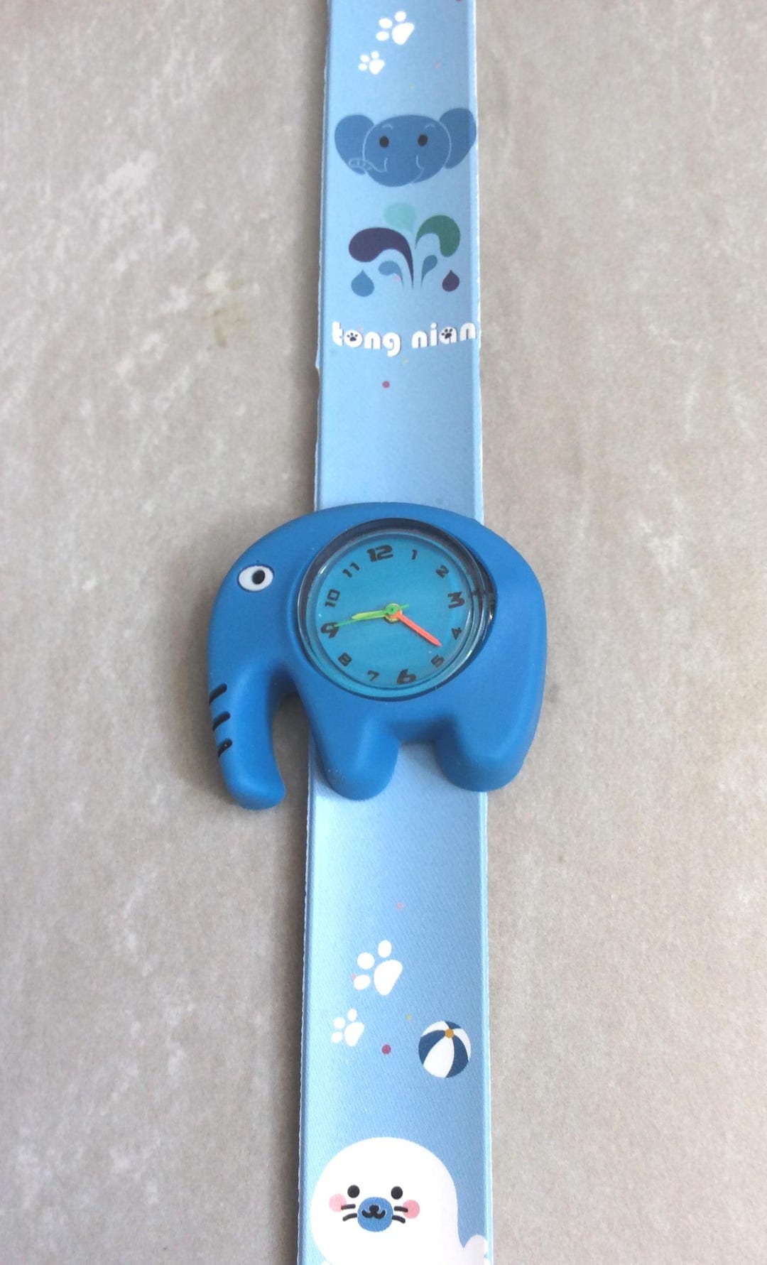 Blue Elephant Watch Round Numbered Dial Having an Elephant Slap-on Band ...
